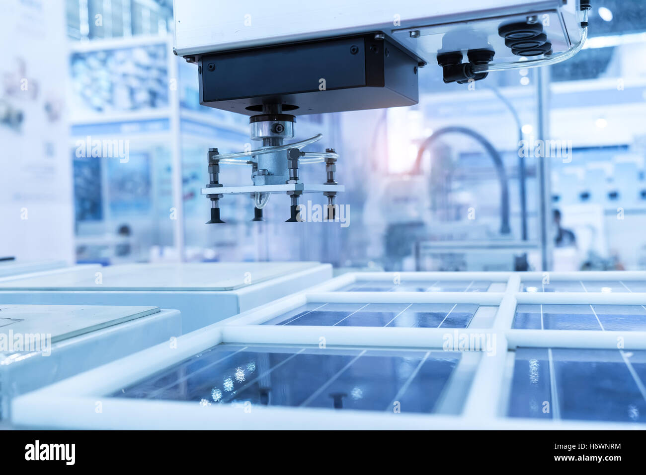 production of solar panels, Industrial robot working in factory ...