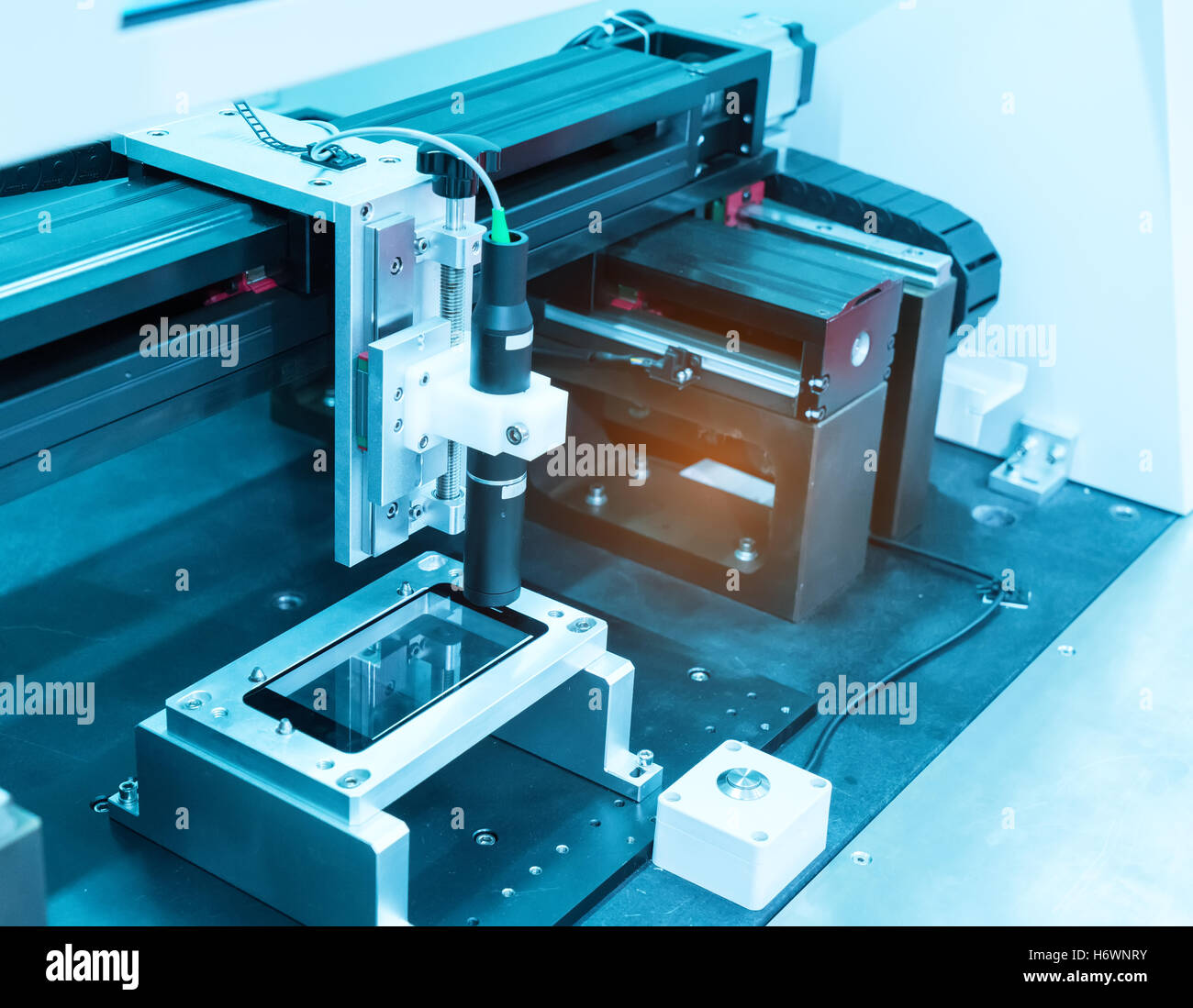 Industrial robot working in phone factory Stock Photo - Alamy