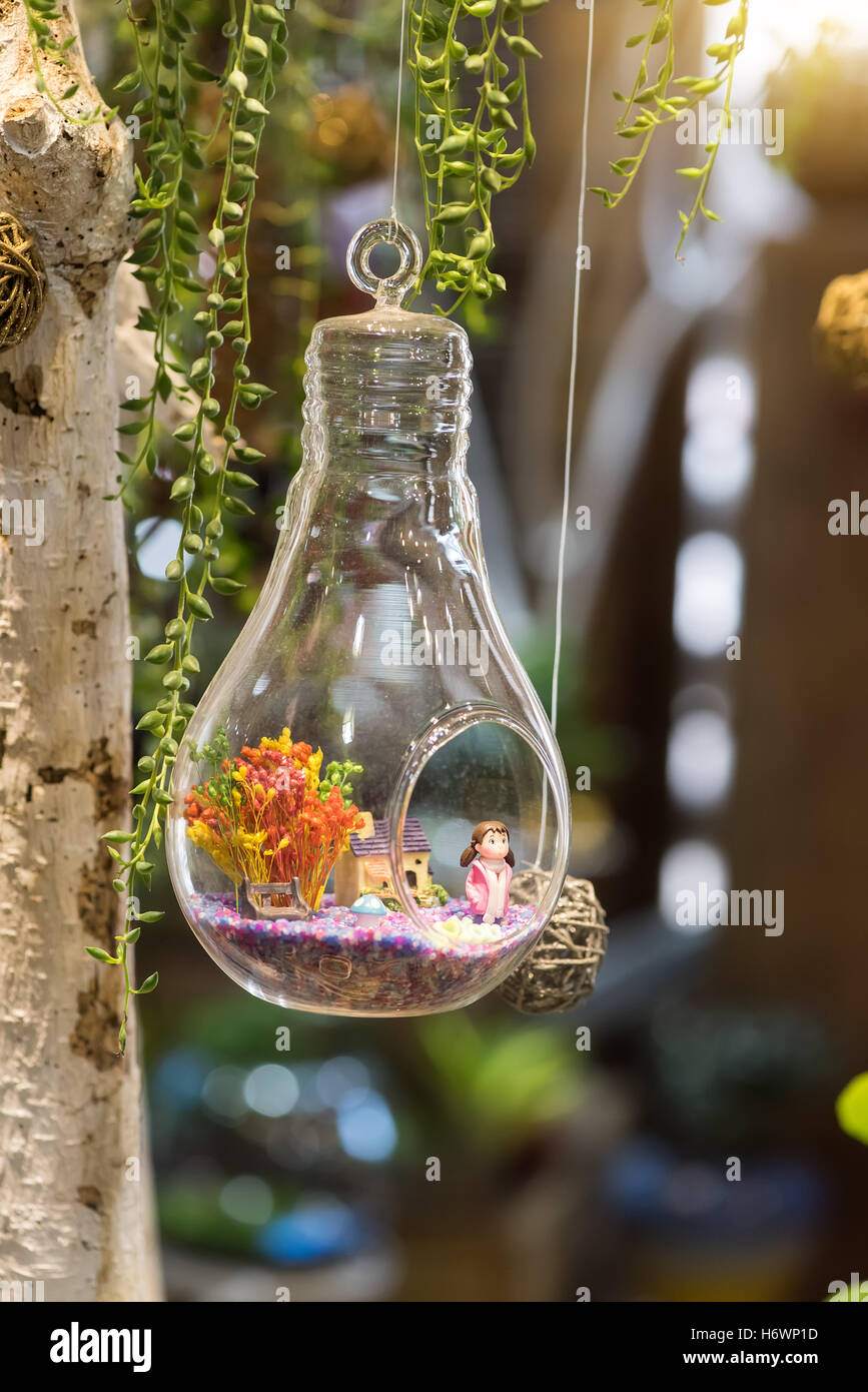 decorative flowers in a light bulb hanging Stock Photo - Alamy