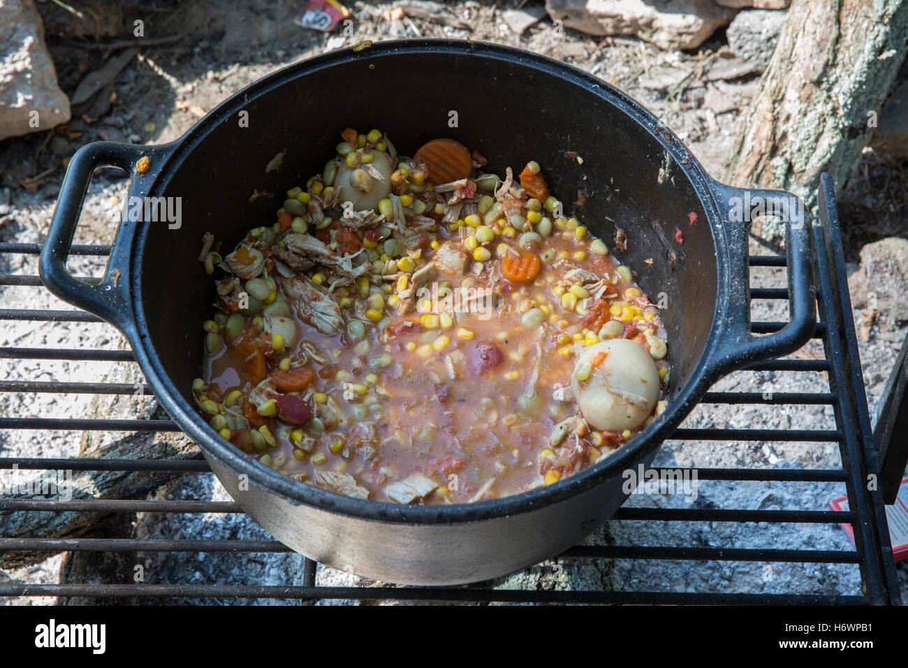 Stew cooking on a campfire Stock Photo - Alamy