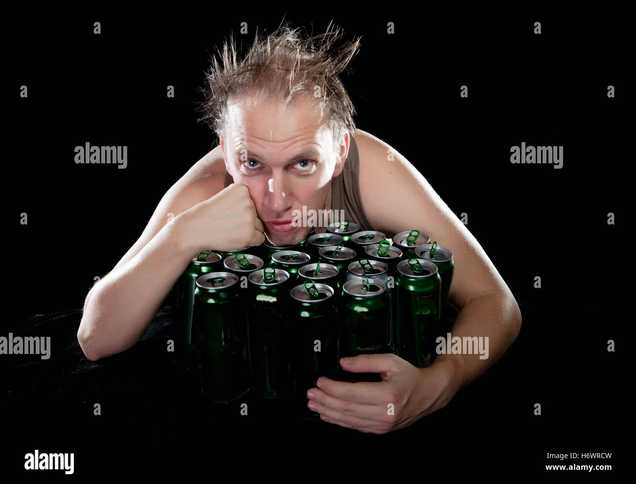 The happy tipsy man near empty beer jars Stock Photo - Alamy