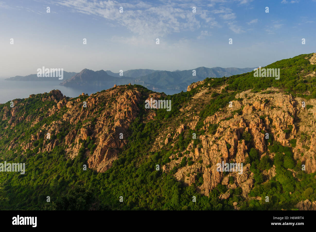 The cliffs of the Calanques de Piana at sunset, in Corsica, France ...