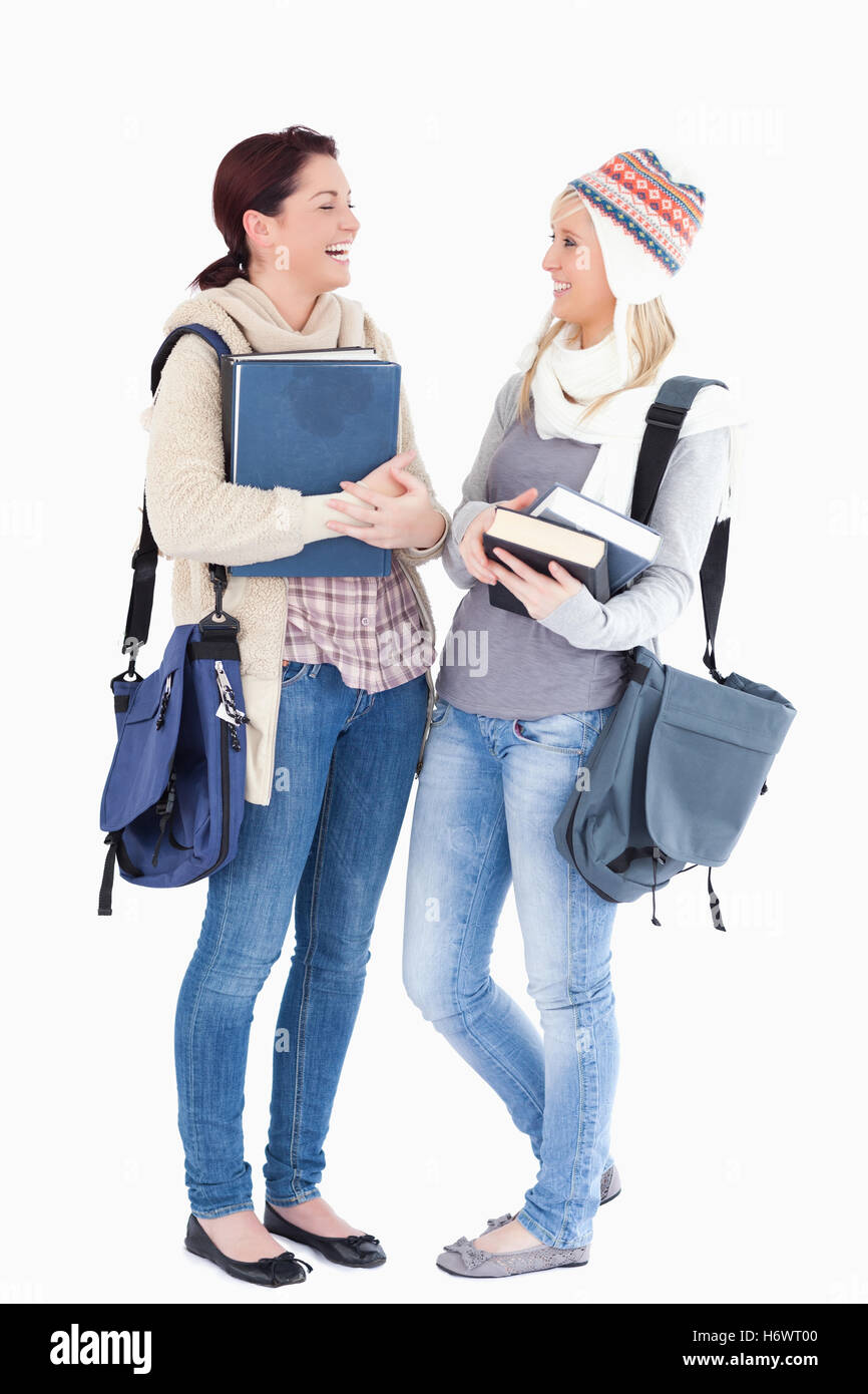 Portrait two students holding books hi-res stock photography and images ...