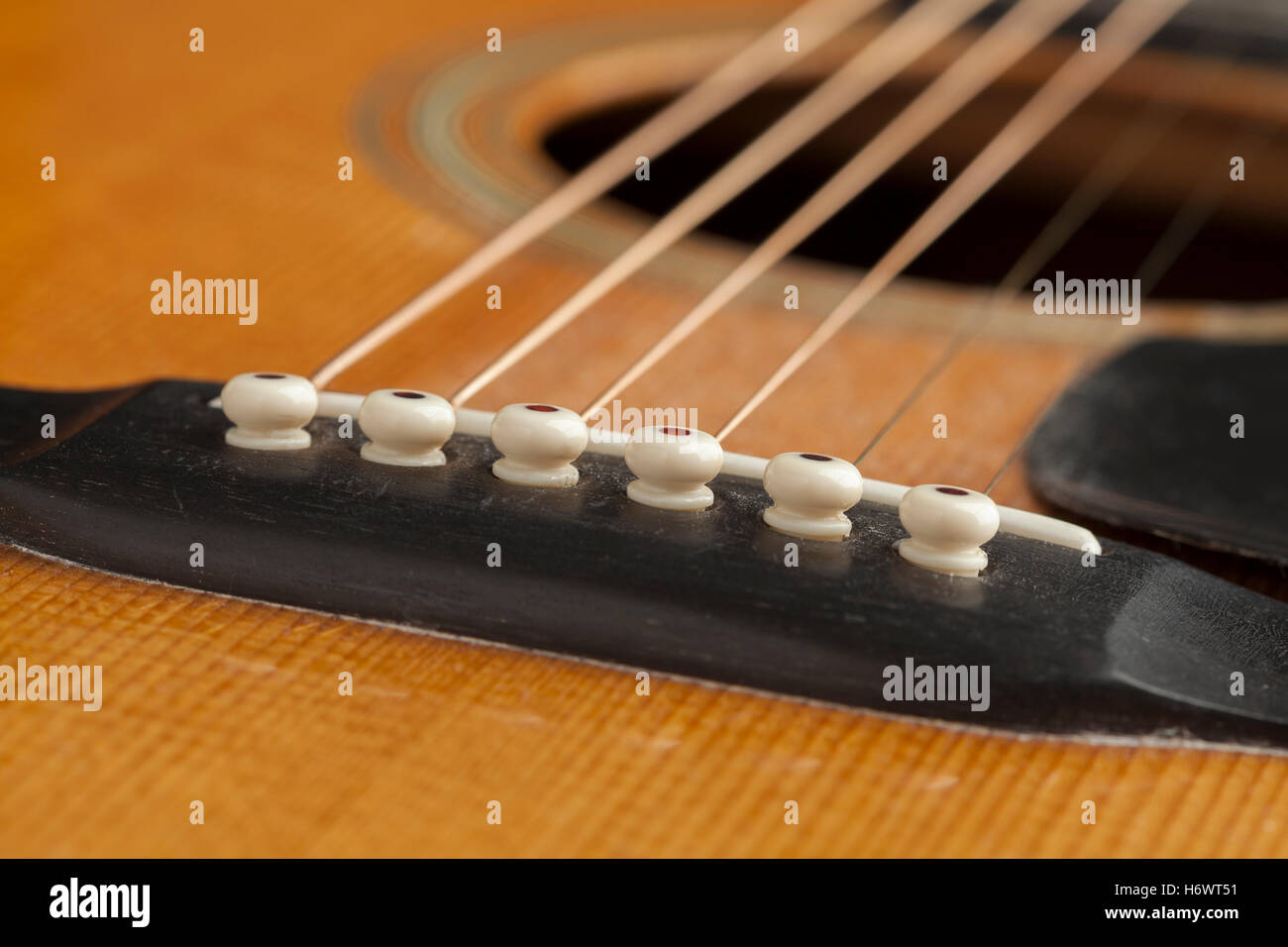 Guitar bridge close up Stock Photo - Alamy