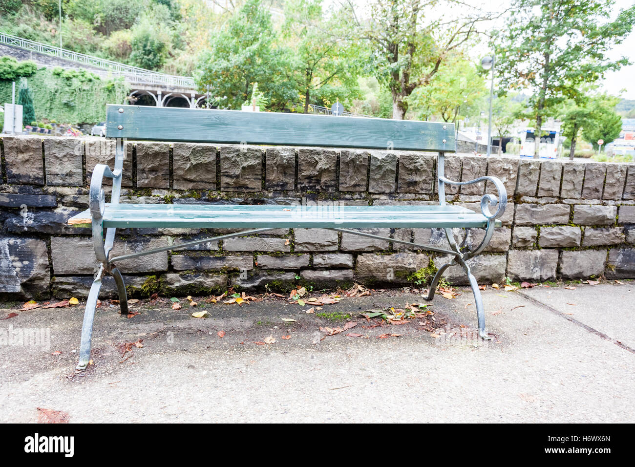 an old wooden bench in the street Stock Photo - Alamy
