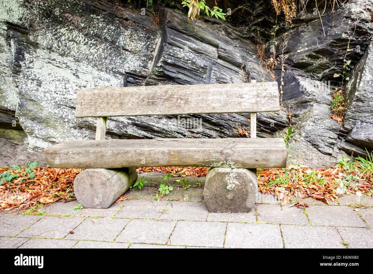 an old wooden bench in the street Stock Photo - Alamy