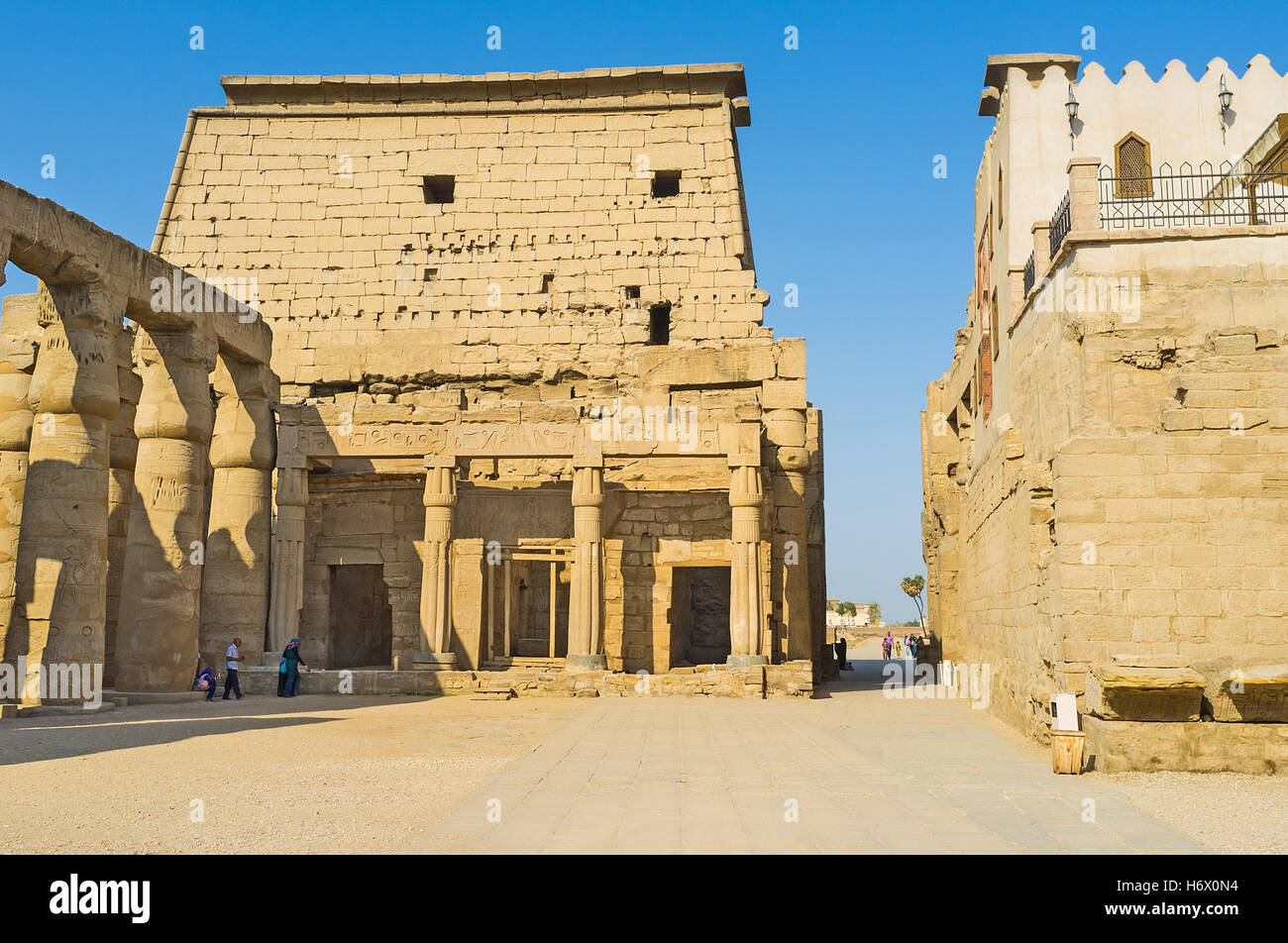 The massive facade wall of the Luxor Temple from inside tilted by huge ...