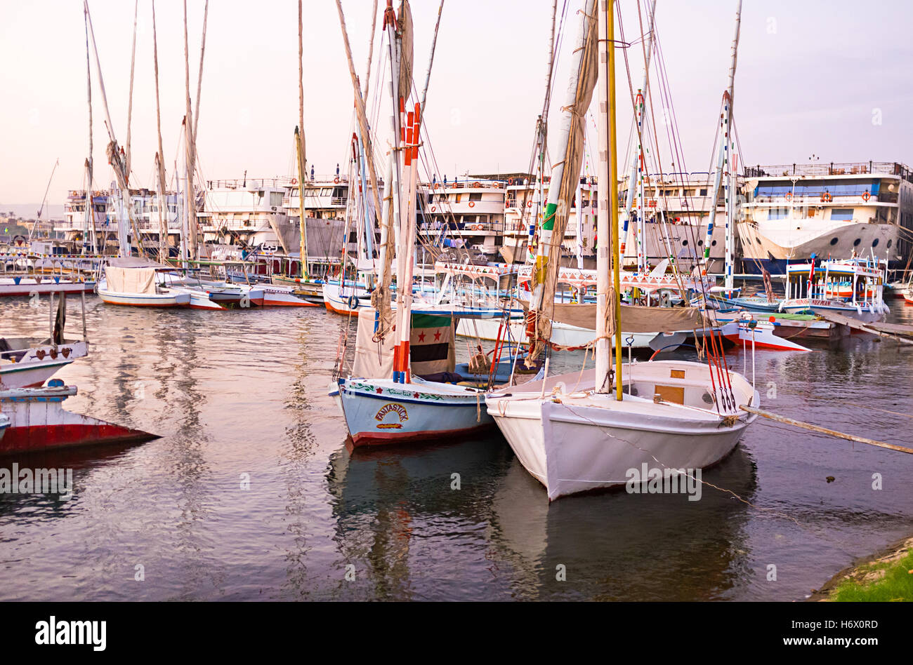 The old traditional feluccas are neighboring with the large cruise ...