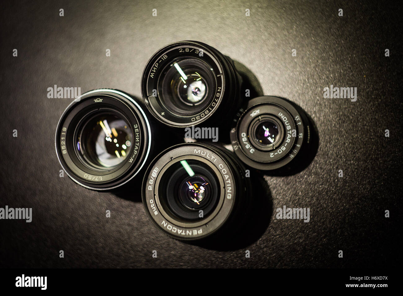 Retro photo camera lens on dark background Stock Photo - Alamy
