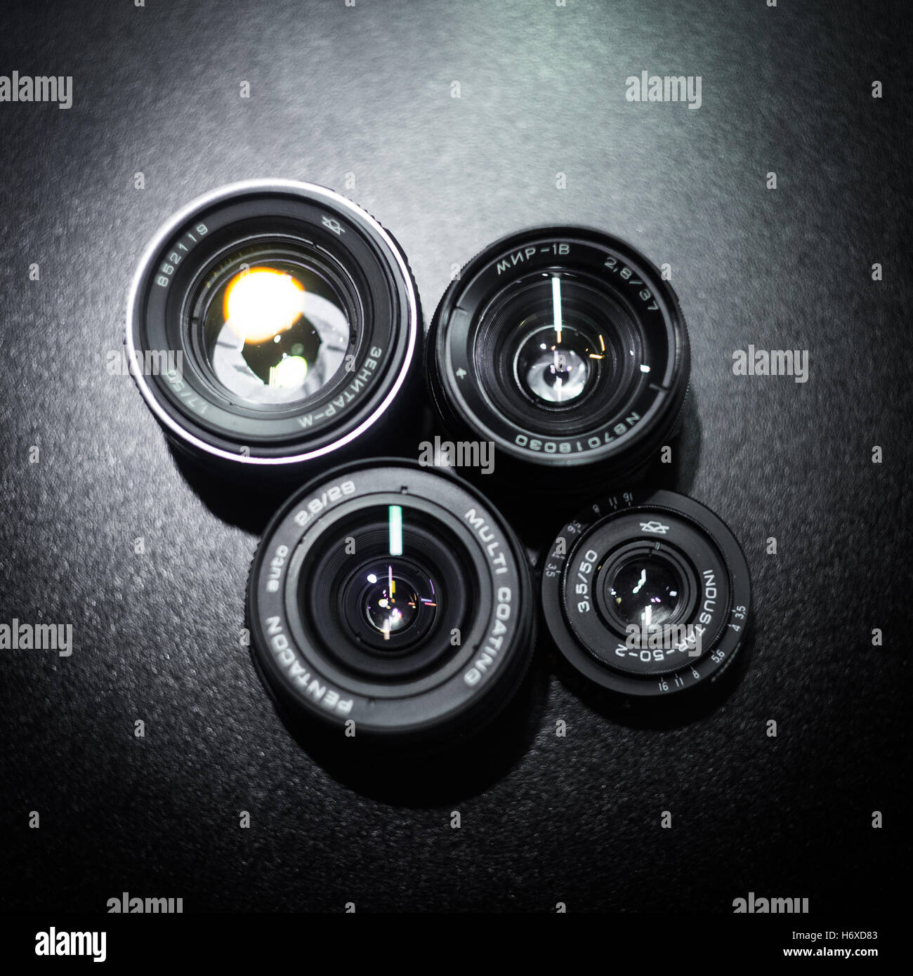 Retro photo camera lens on dark background Stock Photo - Alamy