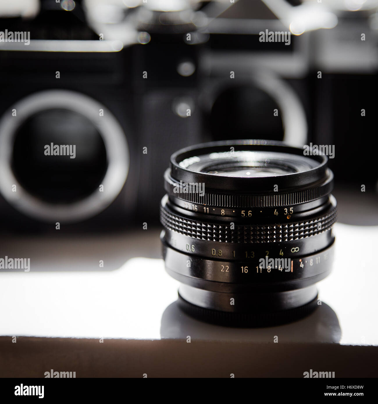 Retro camera lens and cameras Stock Photo - Alamy