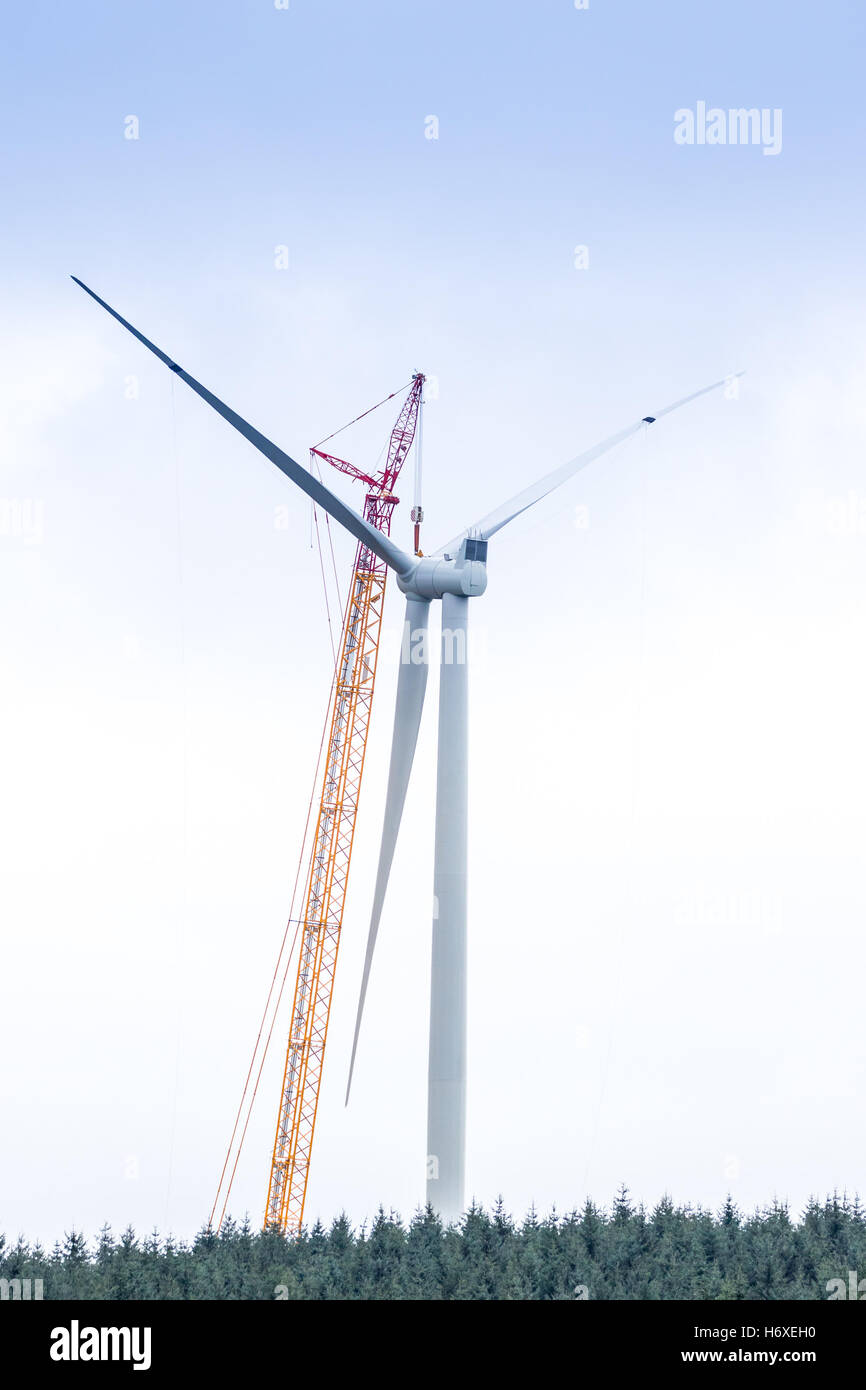 Wind Turbine in the process of being built with a crane lifting the ...