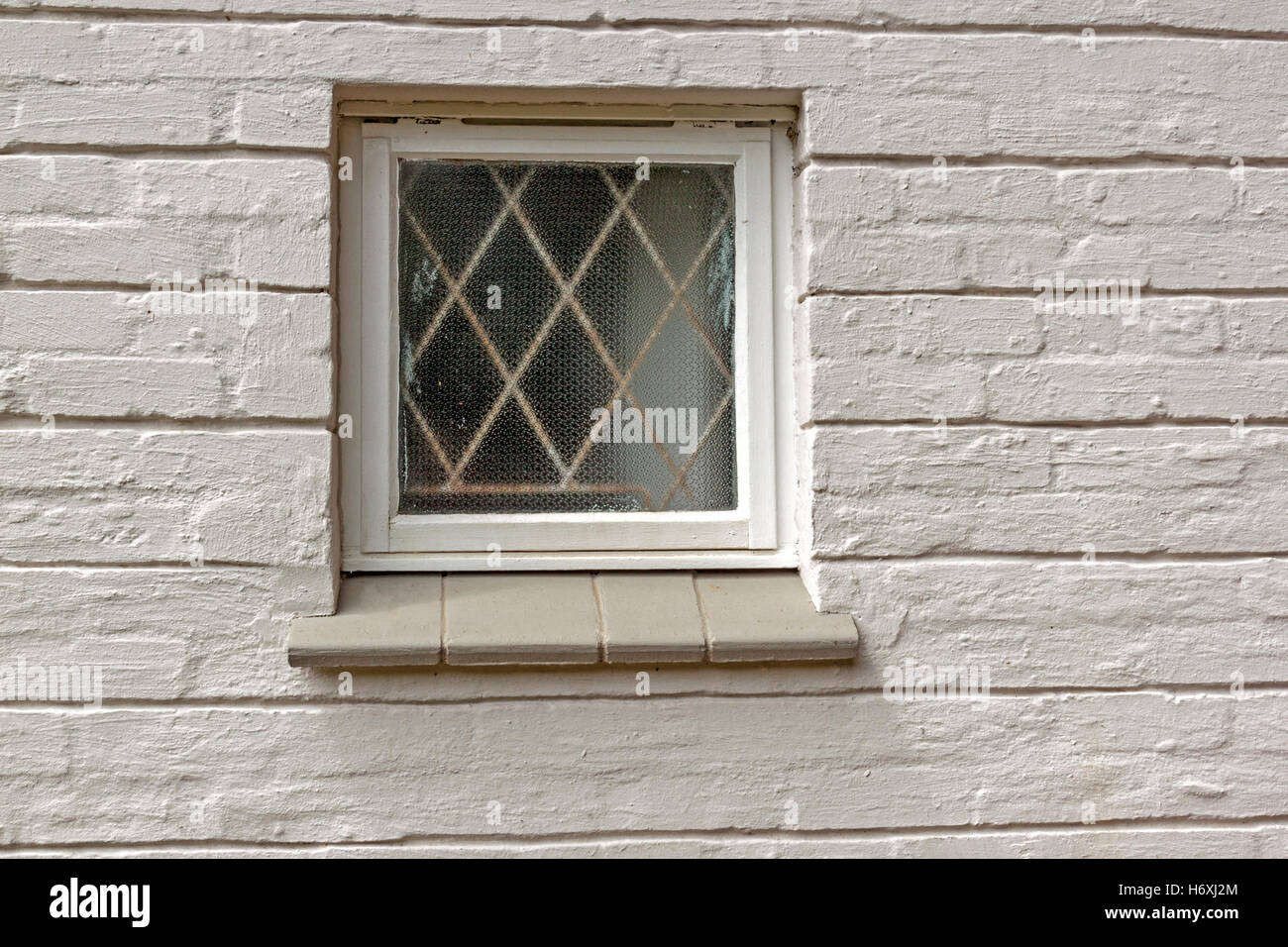 Close up of window lines patterns and texture of cement covered brick ...