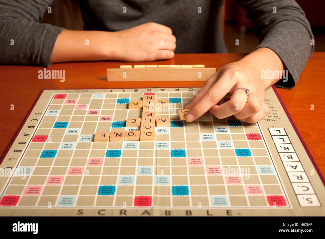 young woman playing game of Scrabble Stock Photo - Alamy