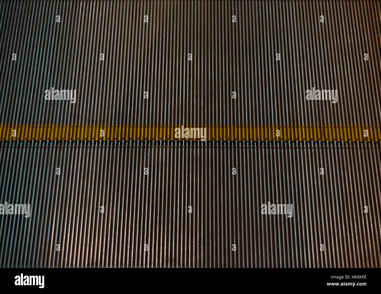 Metal escalator step texture, multiple stripes, yellow horizontal line ...