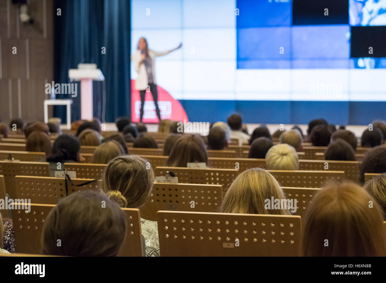 Audience listening a lecture Stock Photo - Alamy