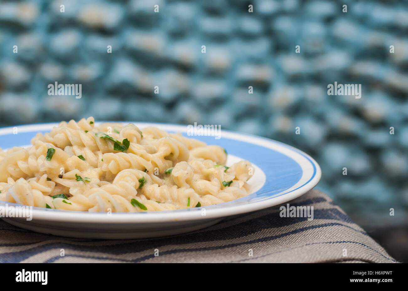 Fusilli pasta in white sauce with basil Stock Photo - Alamy