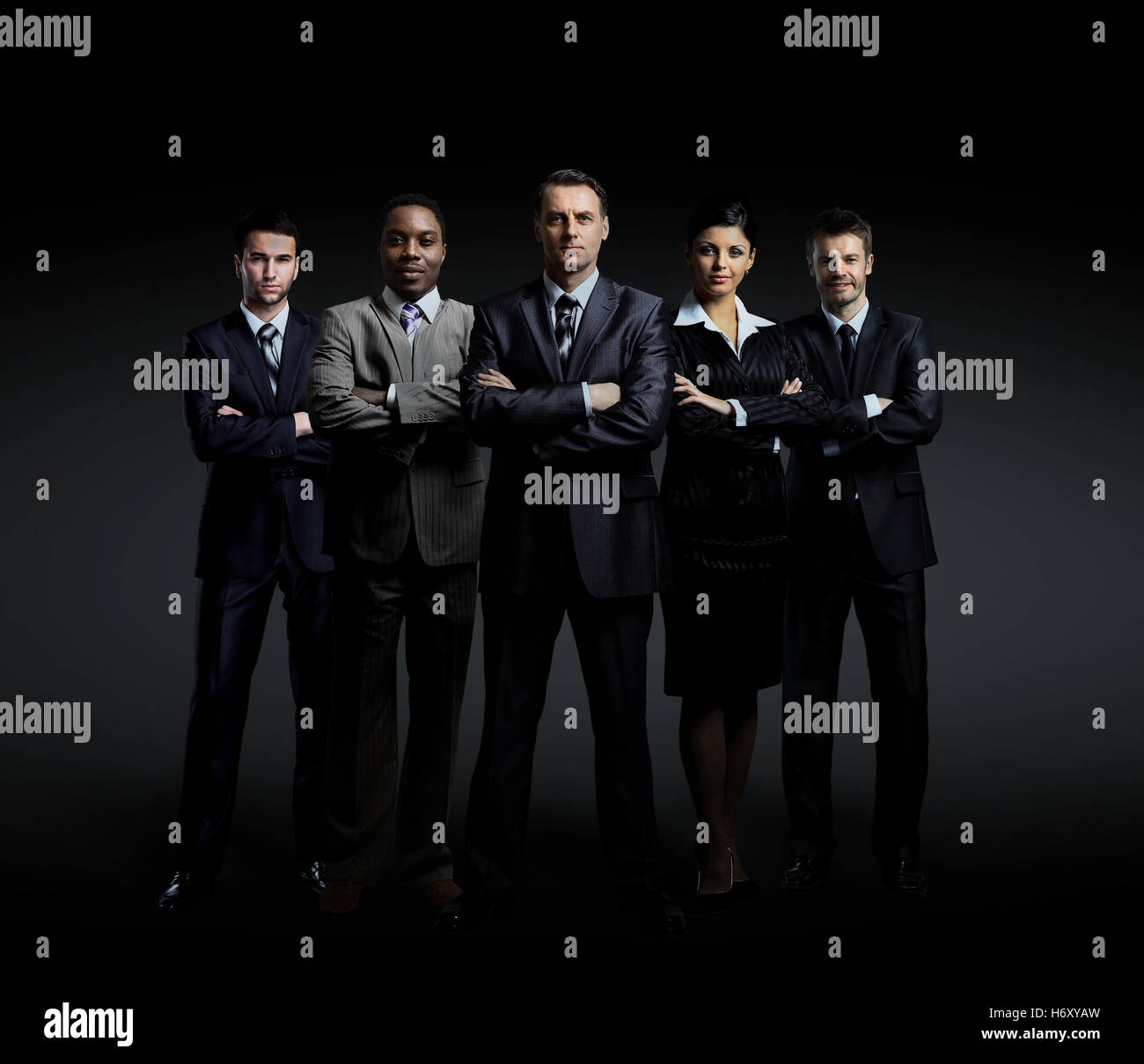 business team standing over a dark background Stock Photo - Alamy