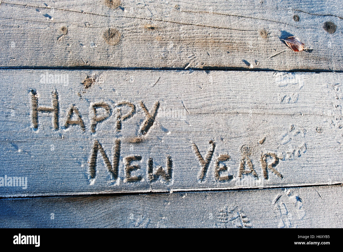 Happy New Year written on a wooden background with frosts Stock Photo ...