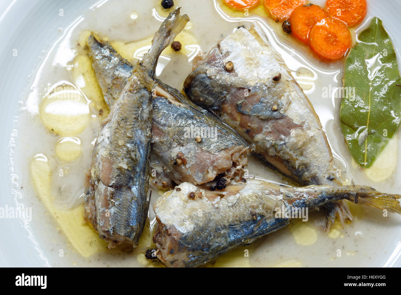 Close up of tasty Marinated mackerel with olive oil Stock Photo - Alamy