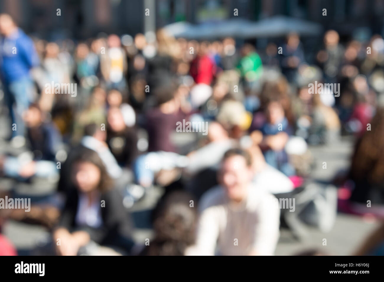 sit in a crowd of people and with objective out of focus Stock Photo ...