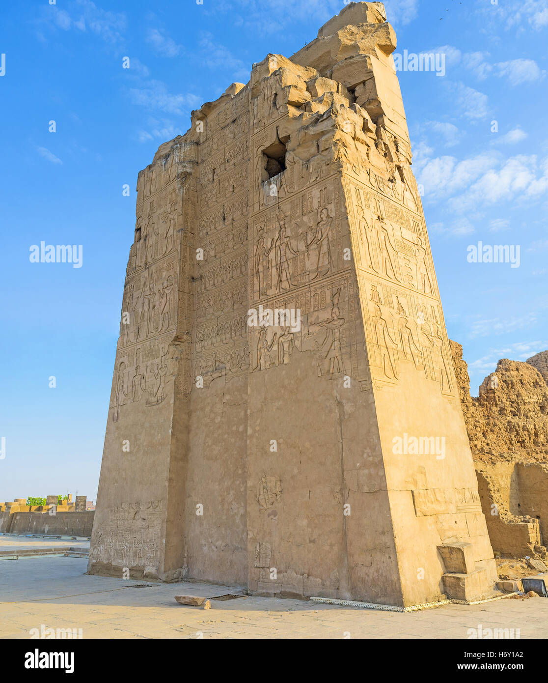 The preserved wall of the Great Pylon of Kom Ombo Temple, covered with ...