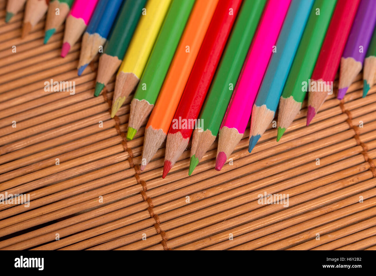 Wooden colorful pencils, on wooden table Stock Photo - Alamy