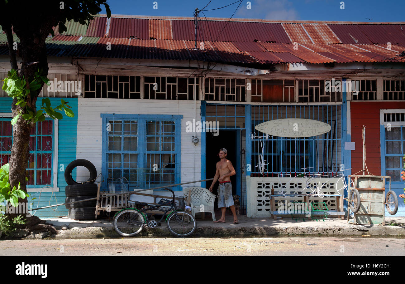 A man standing outside a workshop in the town of Punta Arenas in Costa ...