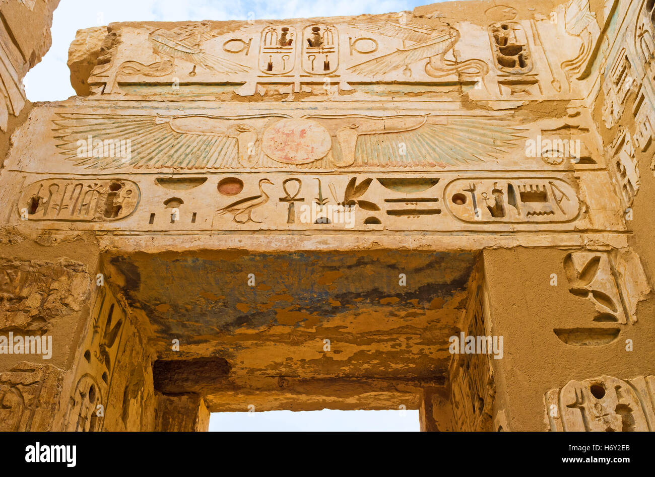 The entrance to the peristyle court in Habu Temple has the massive door ...