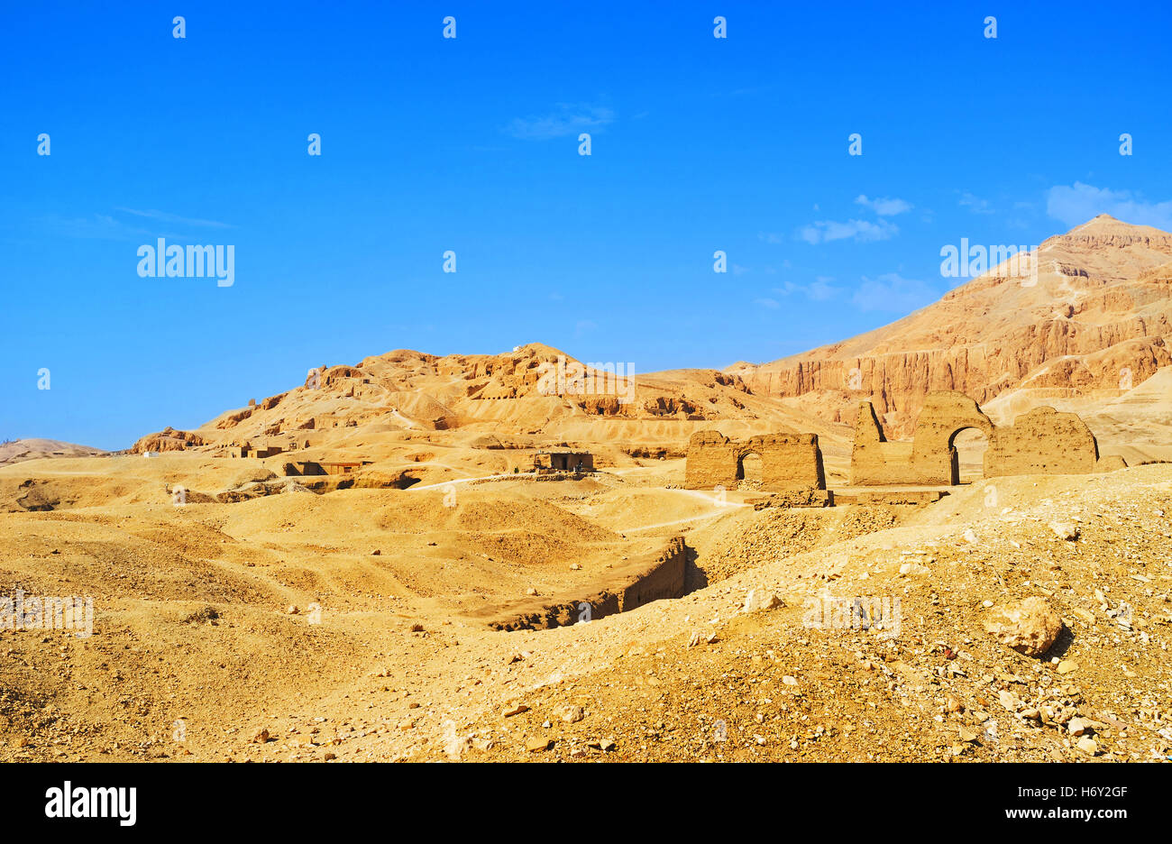 The large desert valley in Theban Necropolis with the ruins of the ...