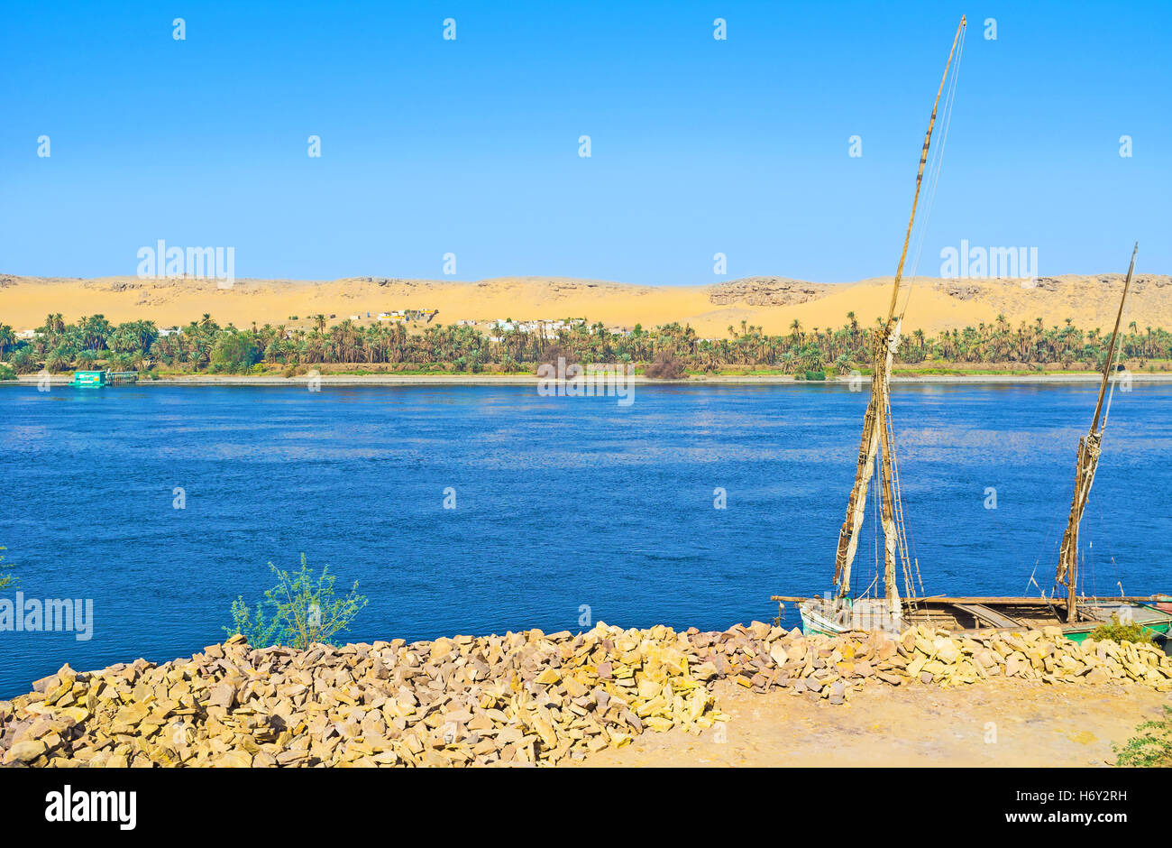 The old felucca on the bank of the Nile river in the Aswan suburb Stock ...