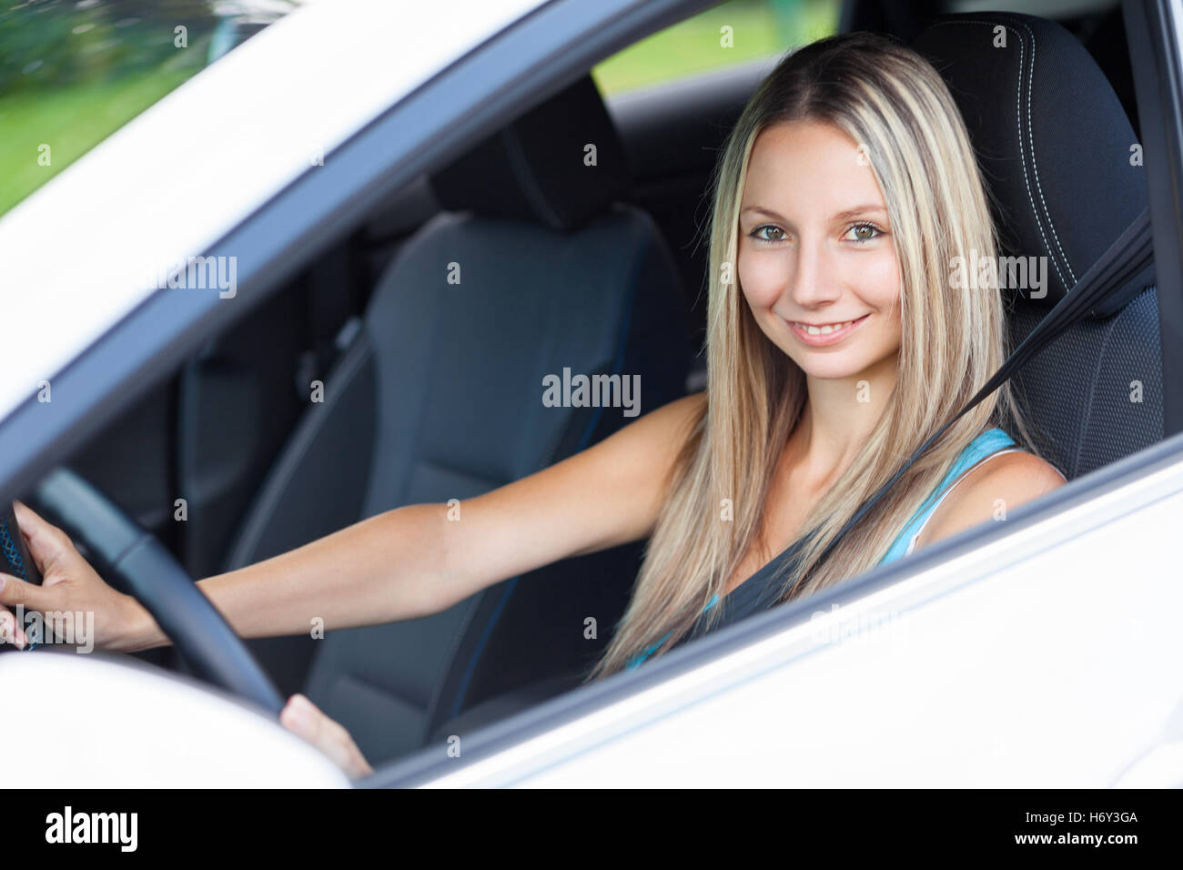 Girl behind steering wheel hi-res stock photography and images - Alamy