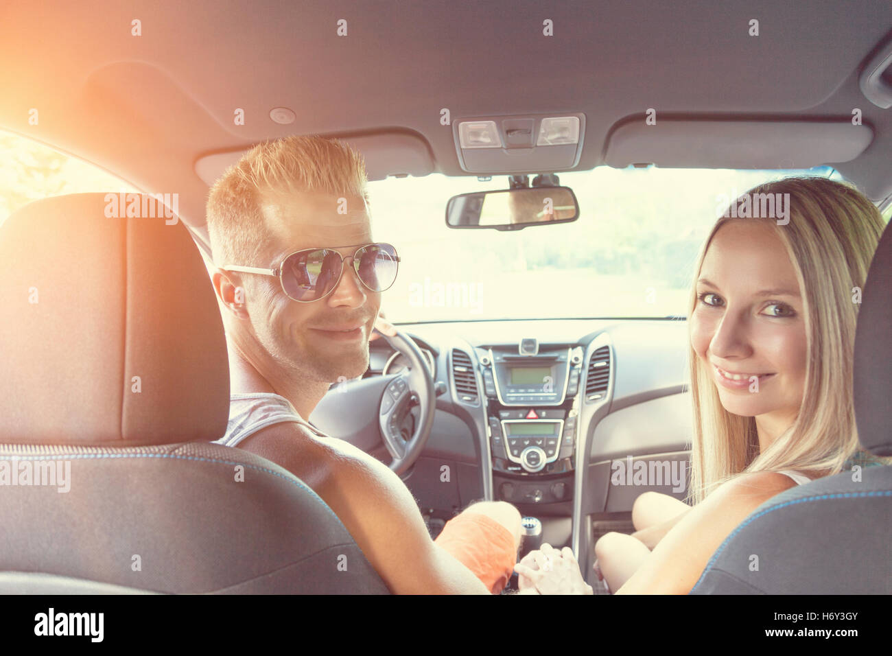 Young happy people enjoying a roadtrip in the car Stock Photo - Alamy