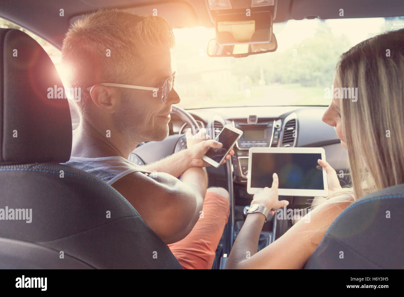 Young happy people enjoying a roadtrip in the car Stock Photo - Alamy