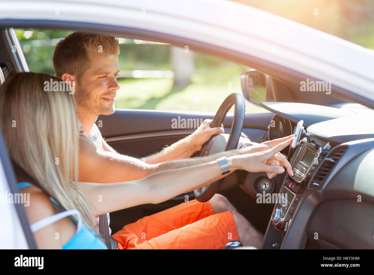 Young happy people enjoying a roadtrip in the car Stock Photo - Alamy