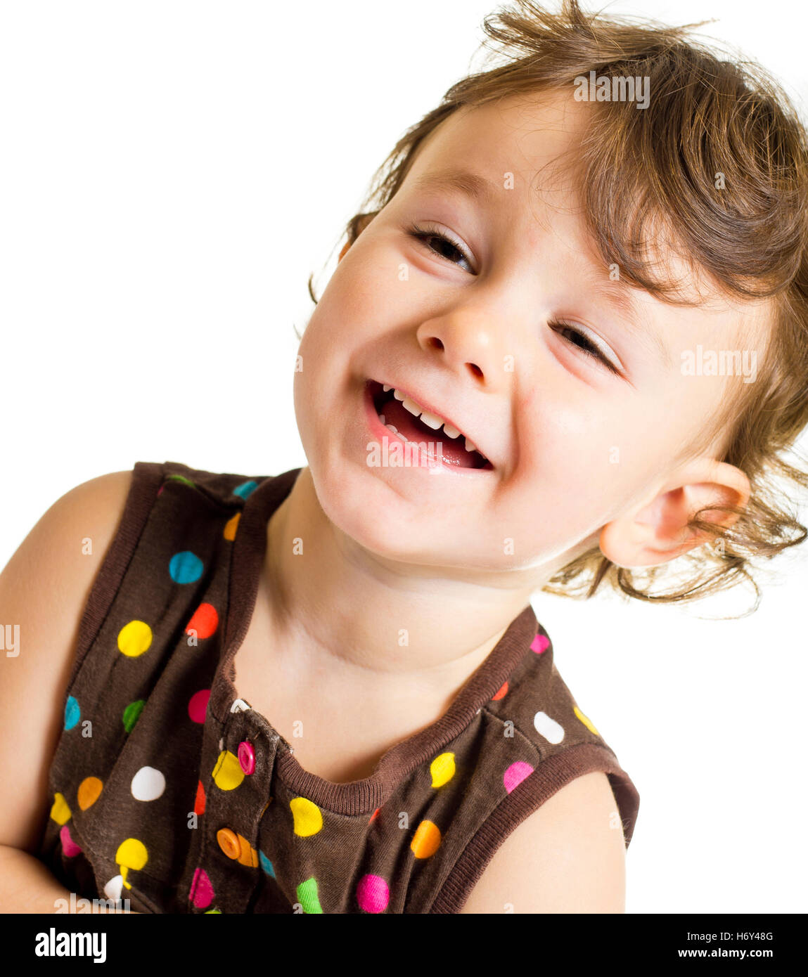 Three years old smiling little girl in brown polka-dot dress Stock ...