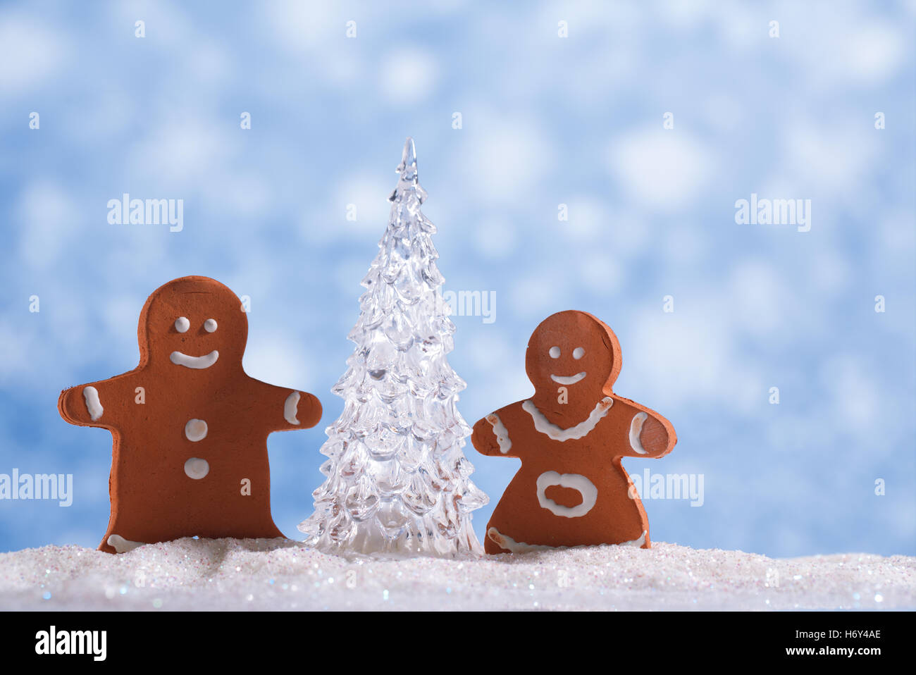 gingerbread boy and girl with Shinny Glass Christmas Tree, abstract ...