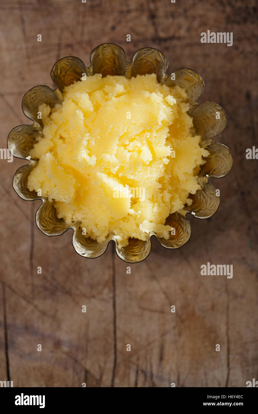 ghee or melted butter in mold on wooden table Stock Photo - Alamy