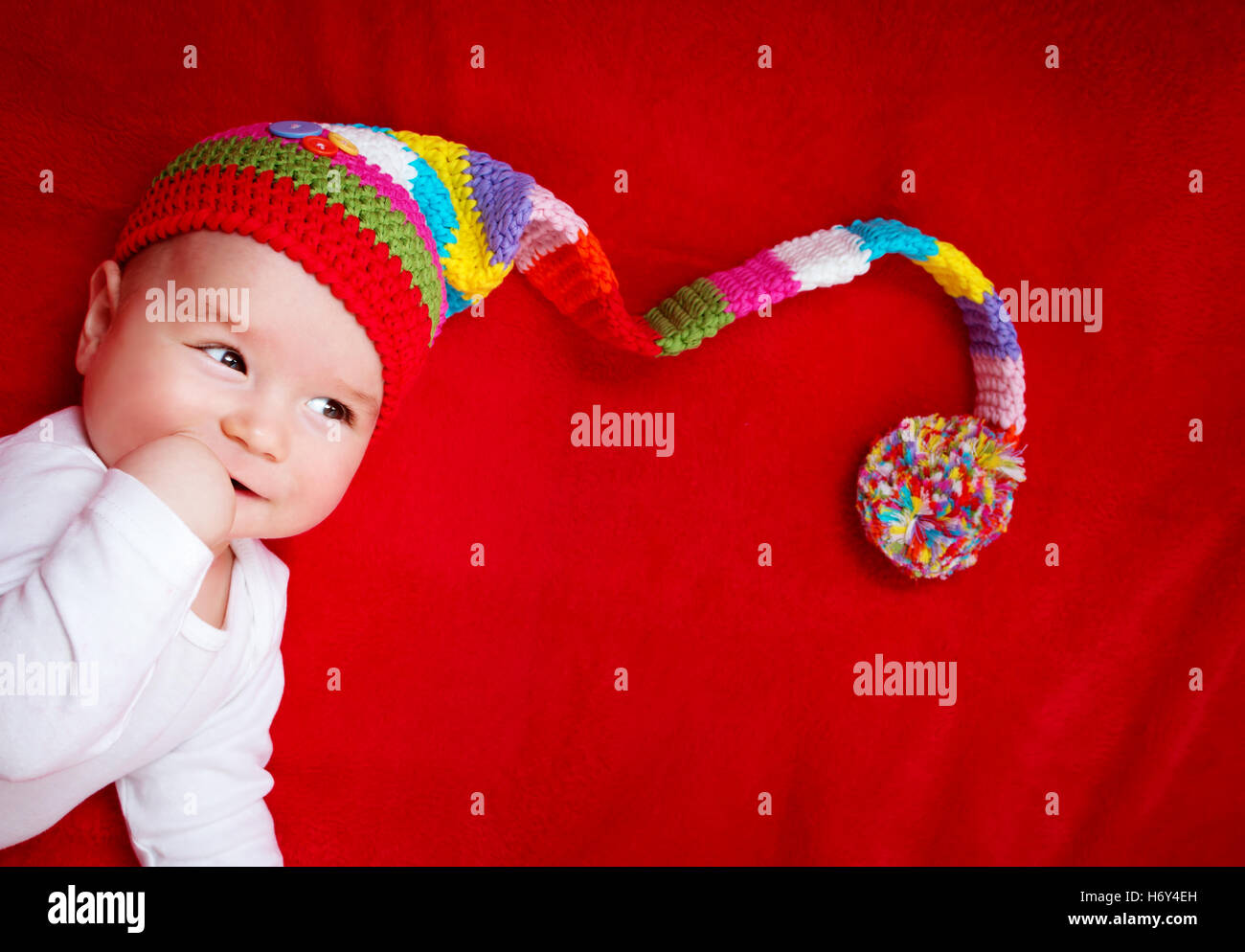 Baby has red cap hi-res stock photography and images - Alamy