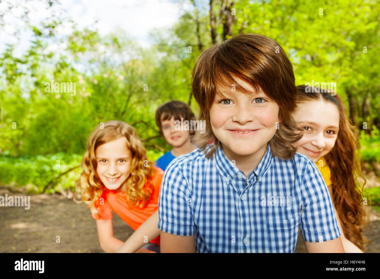 Smiling happy kids having fun in summer park Stock Photo - Alamy