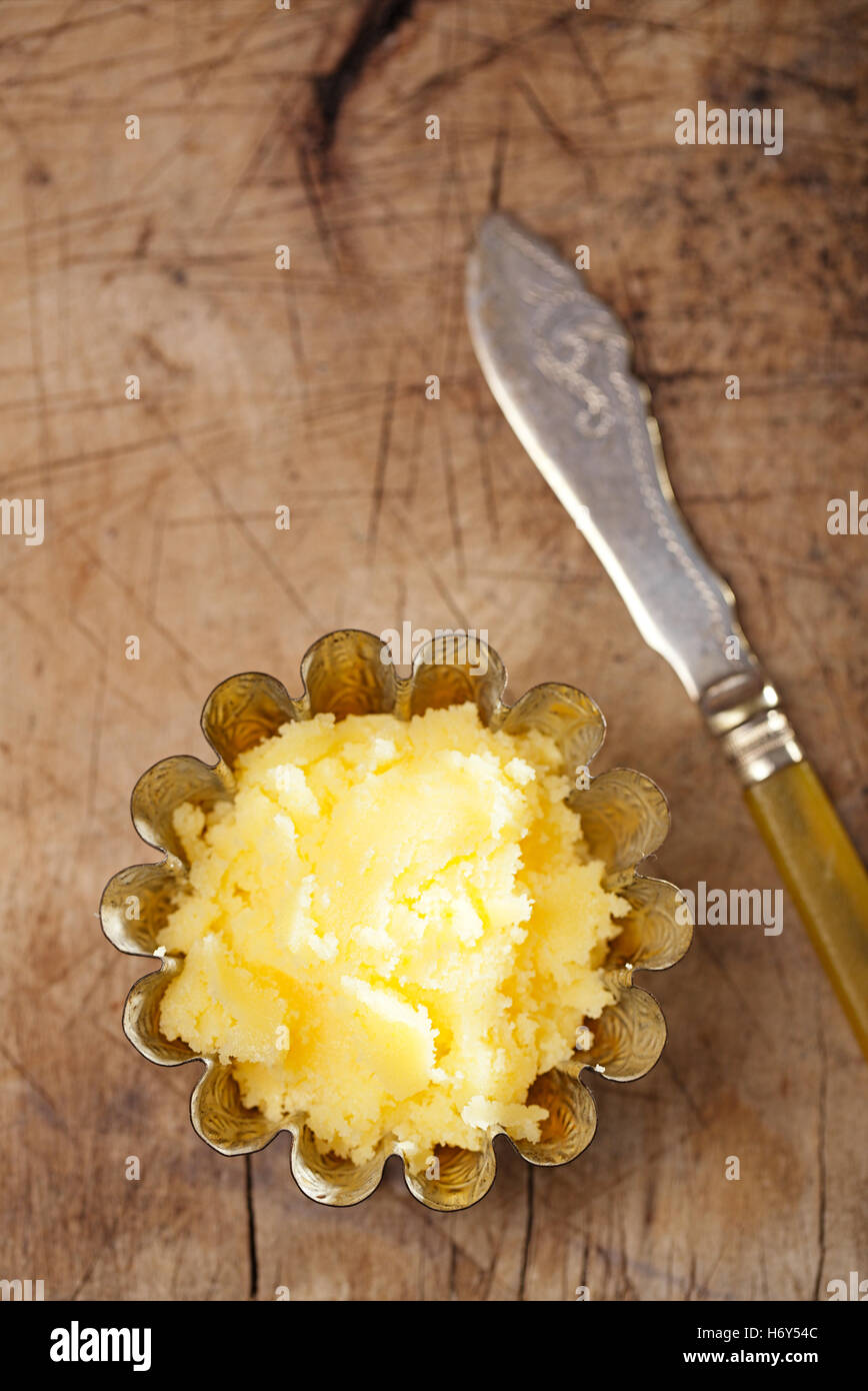 ghee or melted butter in mold on wooden table Stock Photo - Alamy
