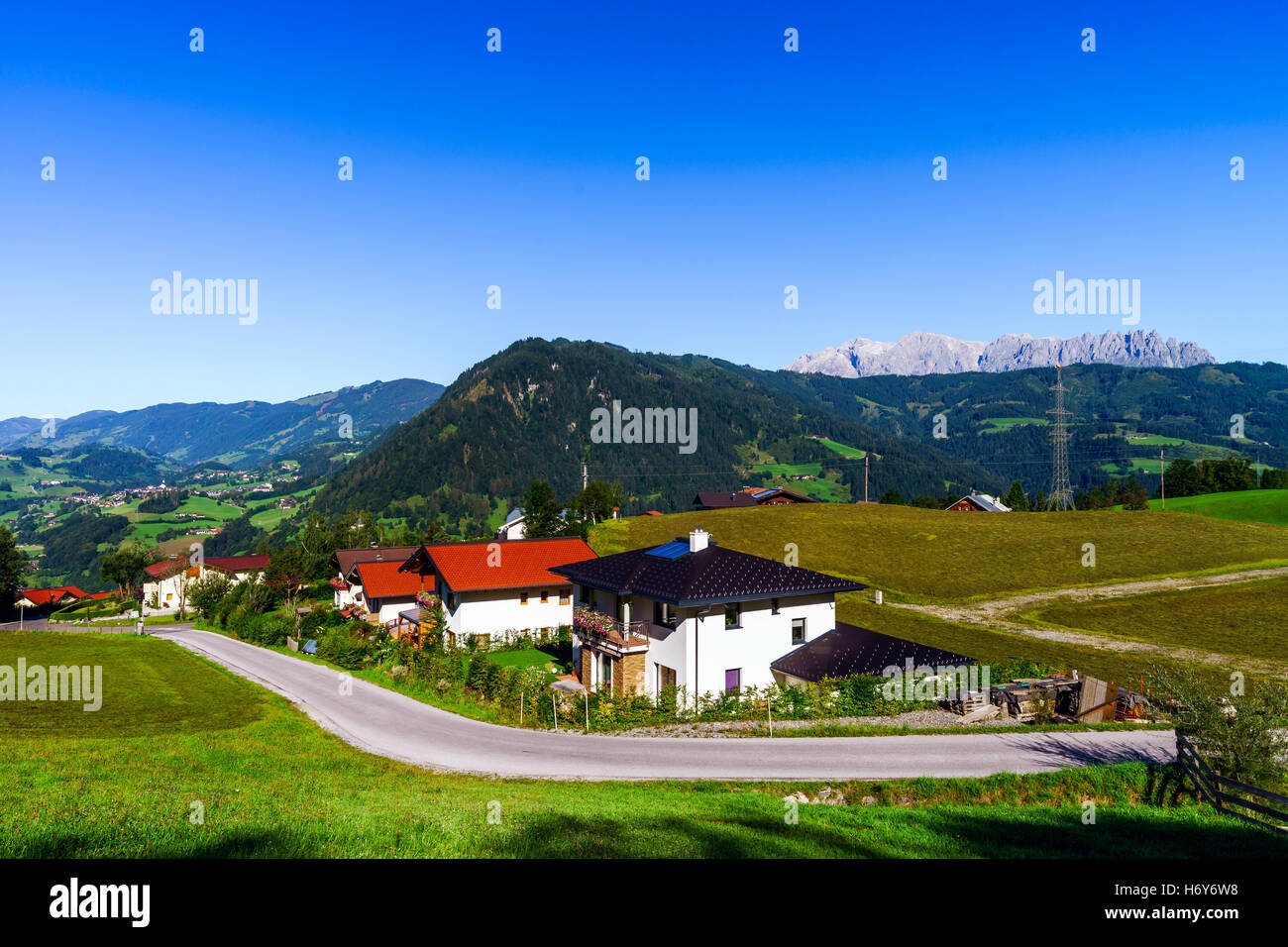 Beautiful alpine summer landscape. Mountains and sun, blue sky, calm ...