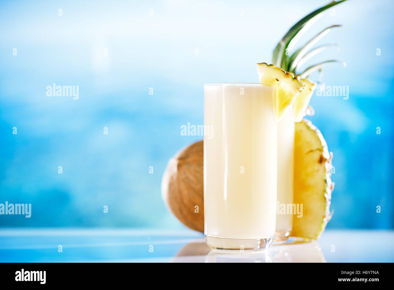 pinacolada pina colada cocktail on beach with seascape background Stock ...