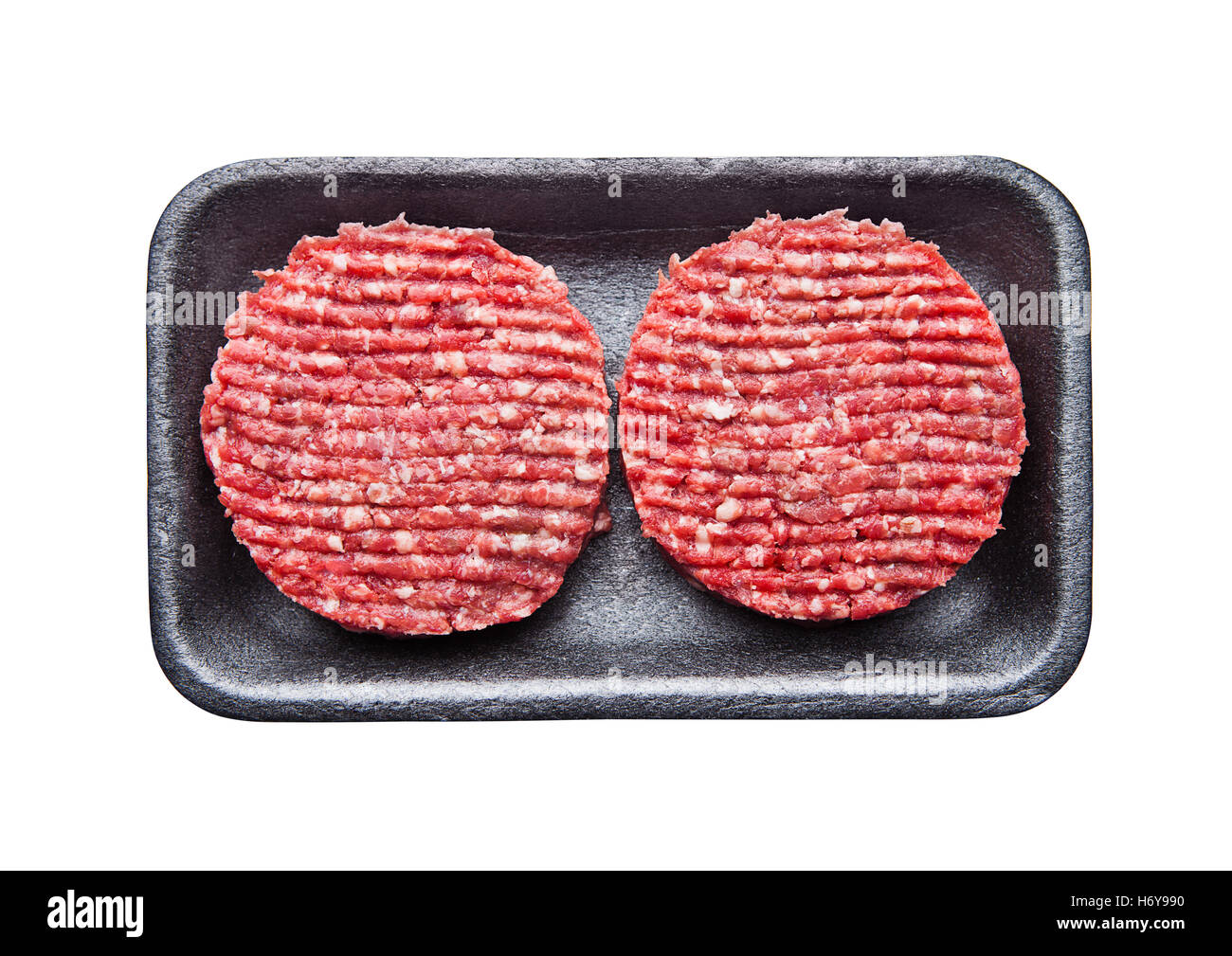 Tray with raw beef burgers isolated on white Stock Photo - Alamy