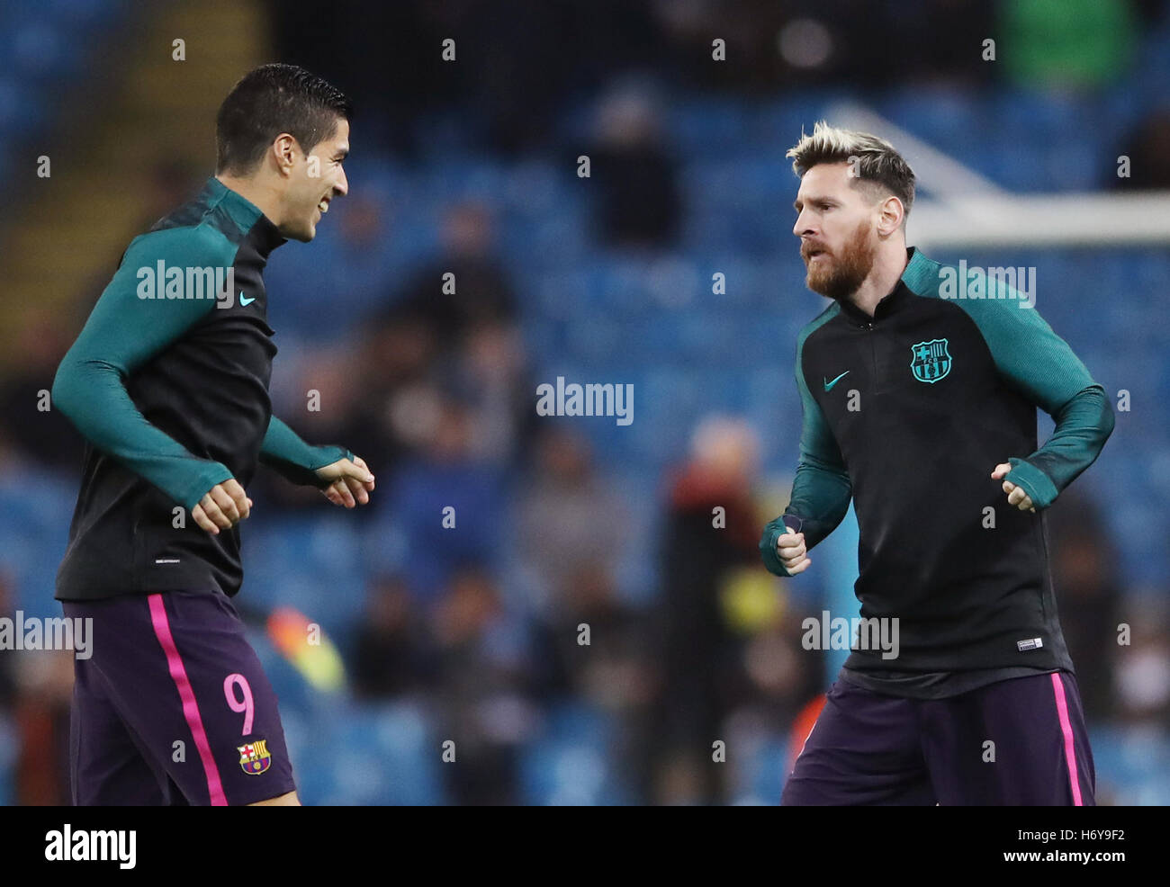 Barcelona's Lionel Messi (right) and Luis Suarez warm up before the ...