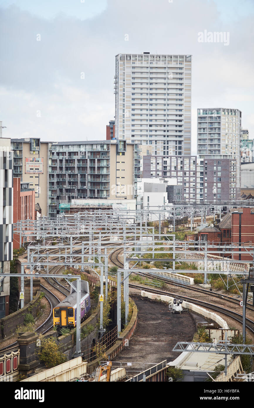 Salford central Station approach Manchester Skyline behind apartments ...