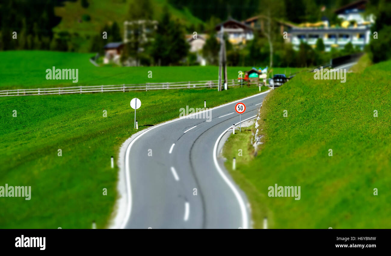 Alpine countryside road in green fields, Austria Stock Photo - Alamy