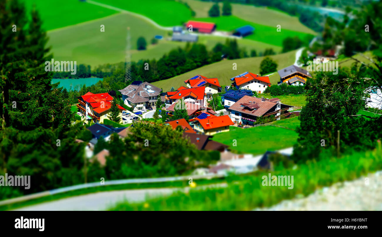 Tilt-shift aerial view of little austrian city in the valley, Austria ...
