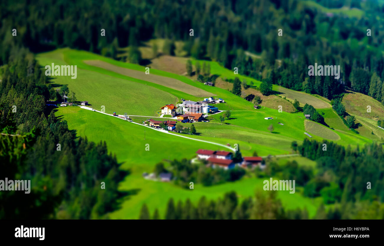 Tilt-shift aerial view of little austrian city in the valley, Austria ...