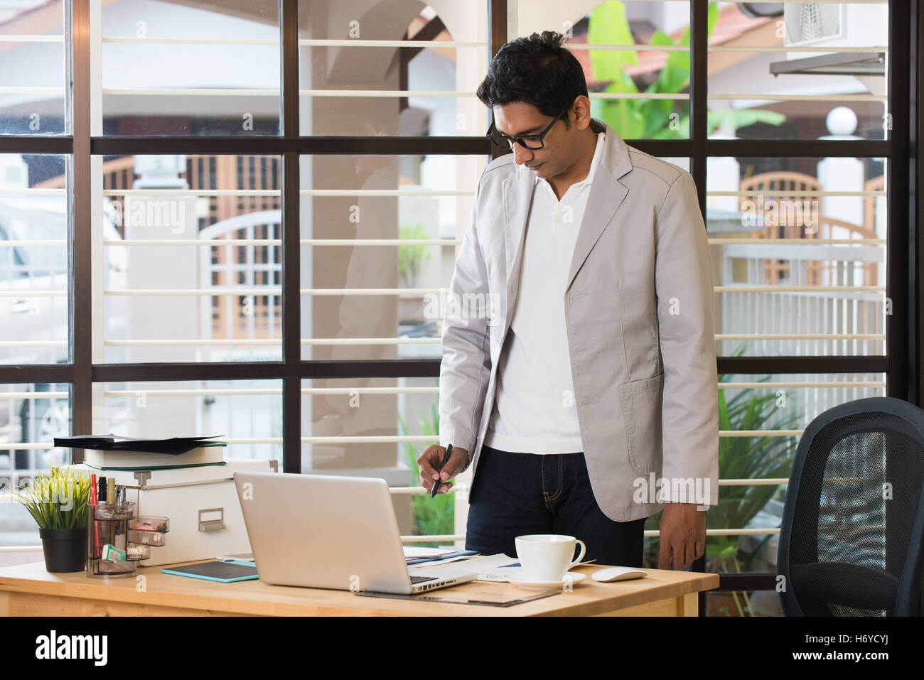 indian male working from office Stock Photo - Alamy